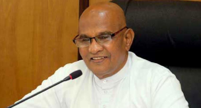 Former Minister Reginald Cooray has died at 74